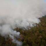 Firefighters continue to fight catastrophic wildfires - Houston Chronicle