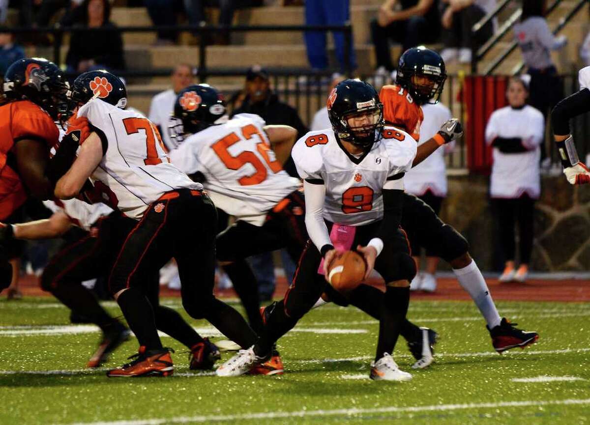 Ridgefield football survives Stamford comeback