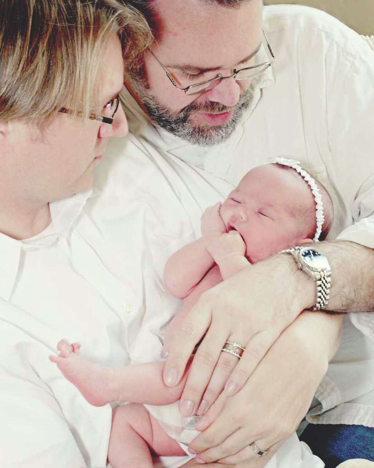 Patience, biology and contracts help determined couple welcome daughter