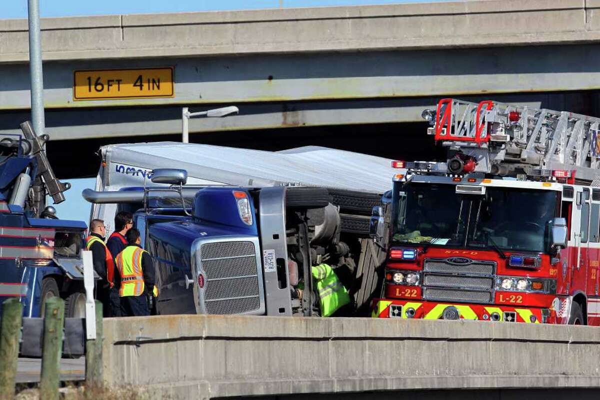 Truck mishap likely to close freeway ramp all day.