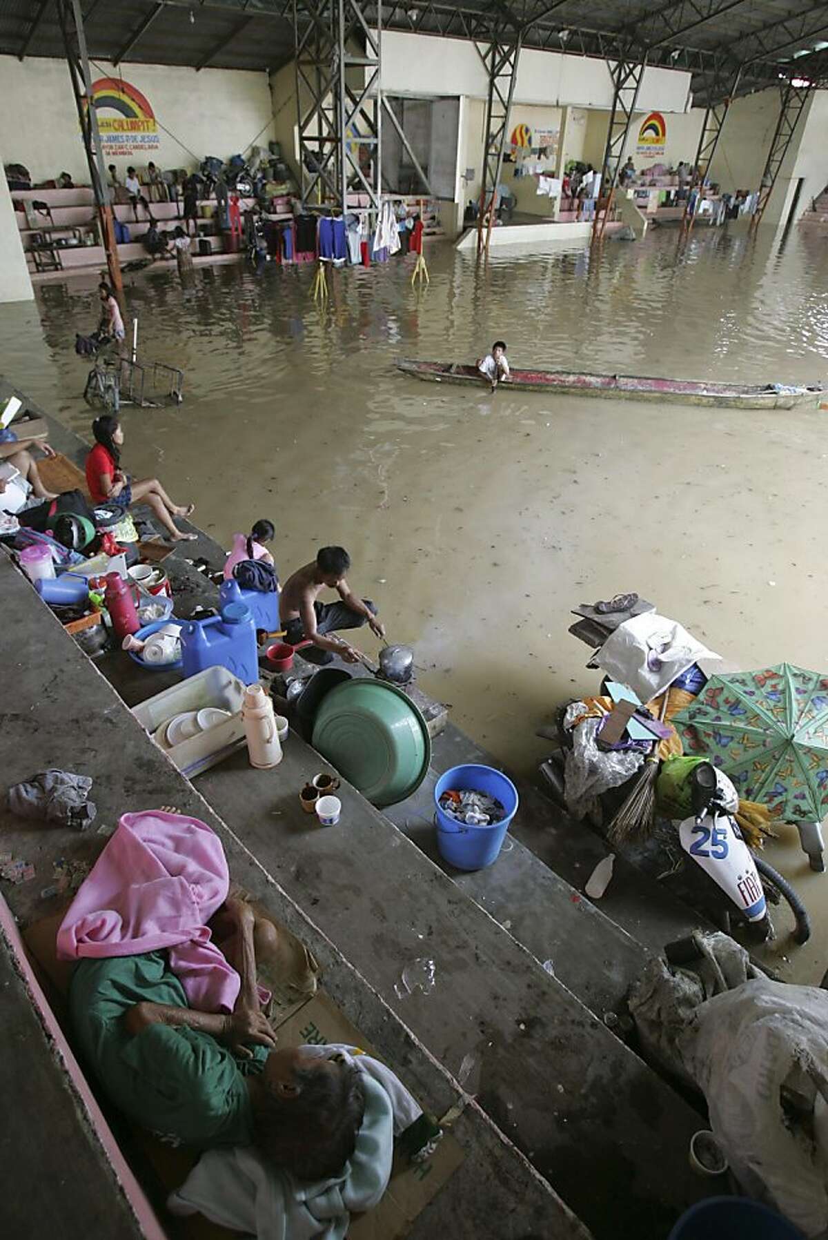 Philippine typhoons kill 59, floods trap hundreds