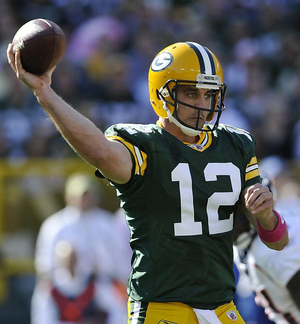 Packers' Rodgers gets it done with arm - and legs