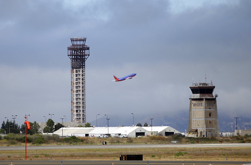 Runway at Oakland International Airport closed after plane catches fire