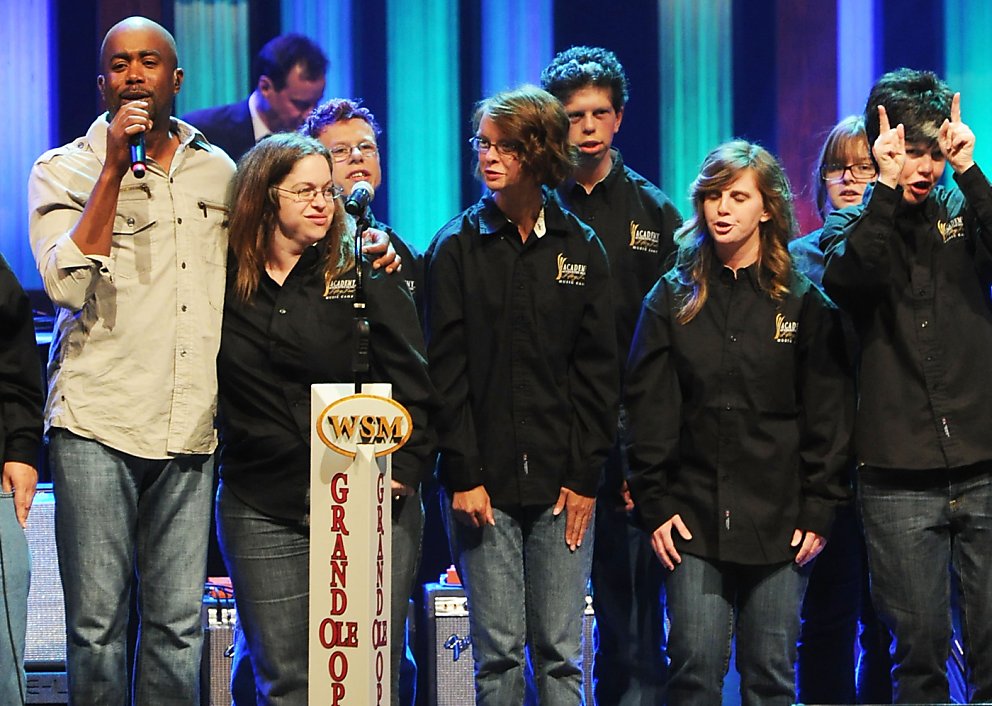 Country stars join disabled young campers in song