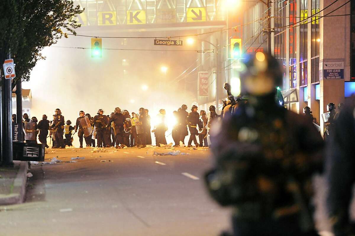 A Couple "Kisses" in the Middle of a Riot