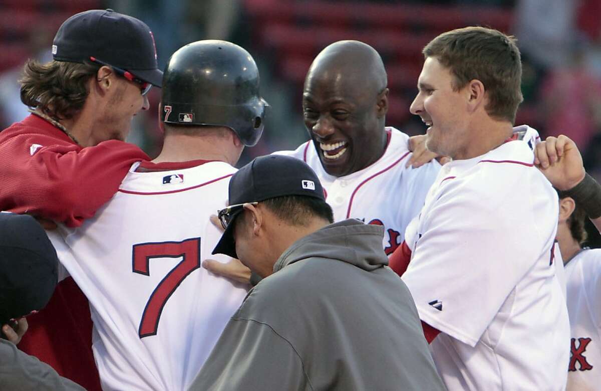 A's rally with 4 in 9th, lose to Red Sox in 14th