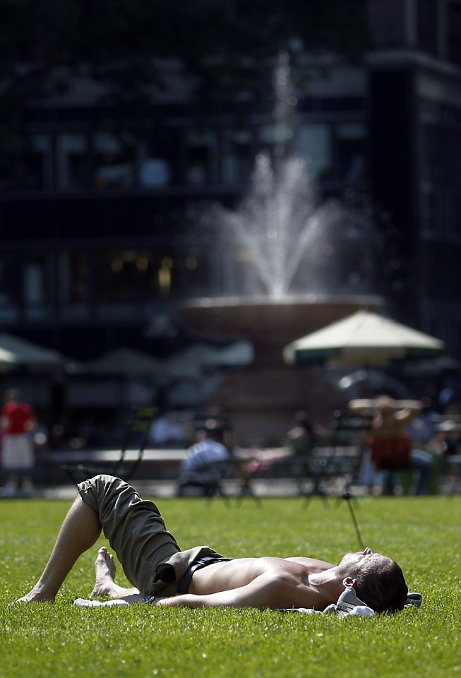 Half the country sizzles in record heat