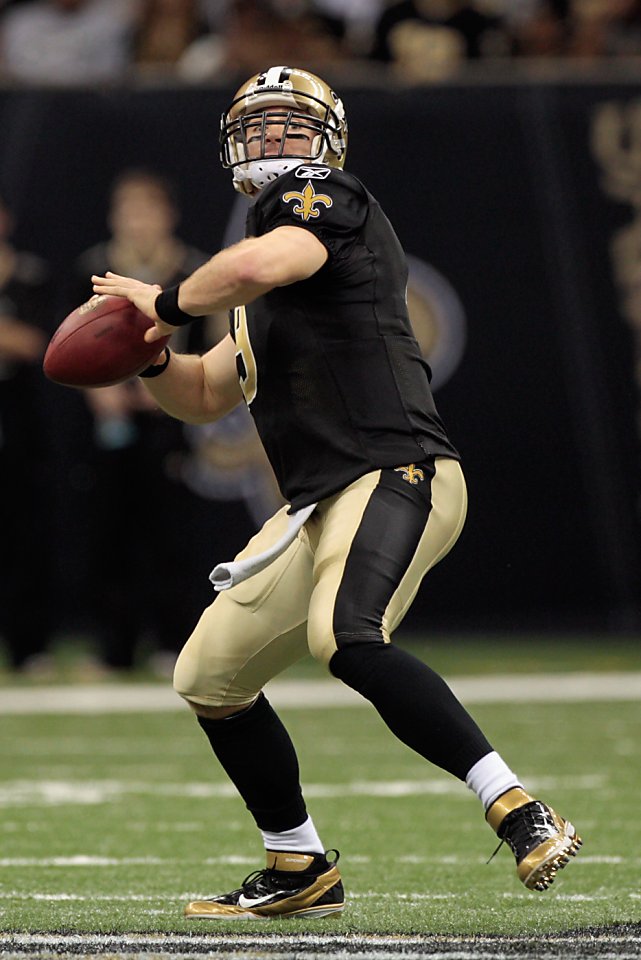 Brees' records: completions, percentage, yardage
