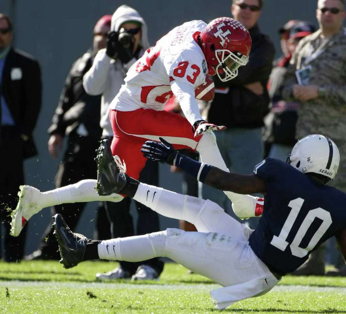 Keenum, UH roll past Penn State in TicketCity Bowl