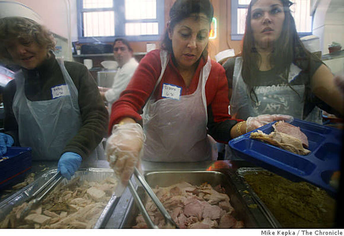 Lines for free Thanksgiving meals growing