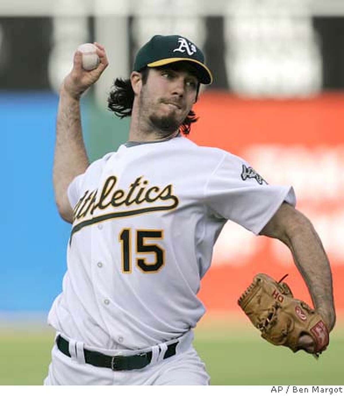 The Jack of all trades / Cust's homer backs Haren as A's dump Giants again