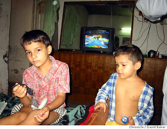 Violence in Iraq puts kids under house arrest / Watching television the ...