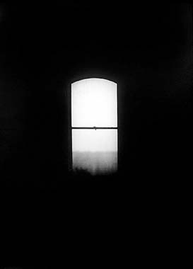 Outside the window, a watcher in the dark