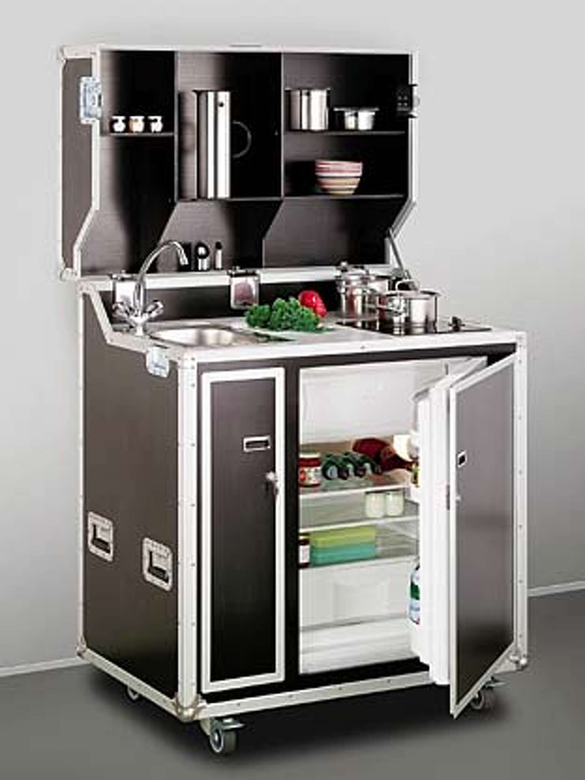 Mini kitchen fits studio or in law unit In tiny spaces furniture must be multitalented