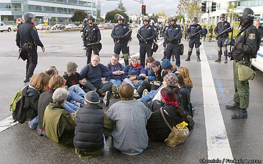 Defense giant endures protest / Peaceful arrests at Lockheed's gates ...
