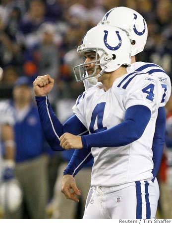 Colts carry Manning for change / Vinatieri, defense do the job in Baltimore