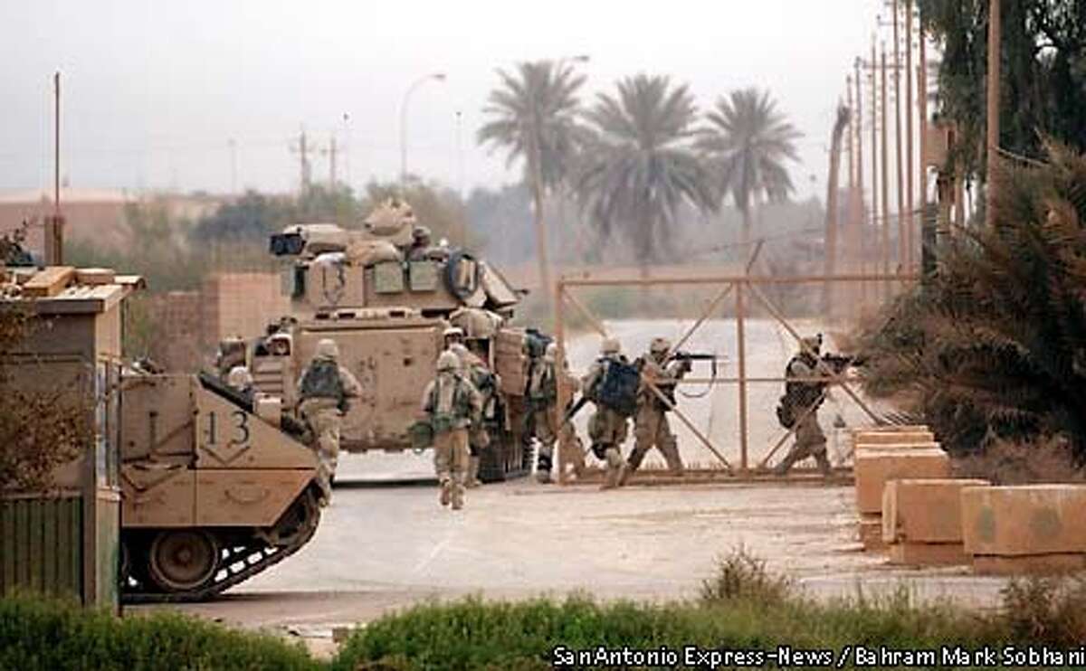 Tanks, troops battle for Baghdad airport / VISE TIGHTENS: Bush sees ...