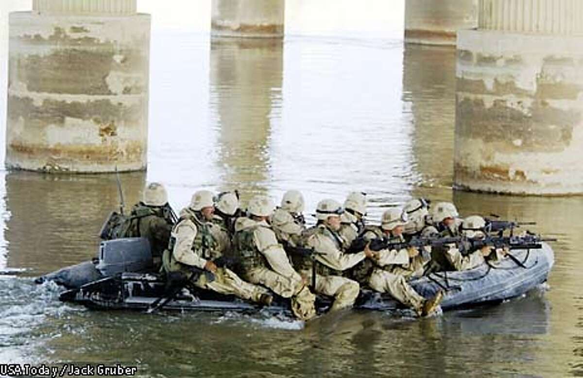 Tanks, troops battle for Baghdad airport / VISE TIGHTENS: Bush sees ...
