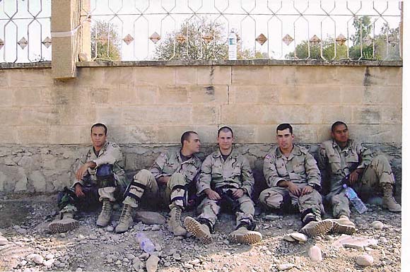 Back from Iraq for a short stay, but a distance still separates them