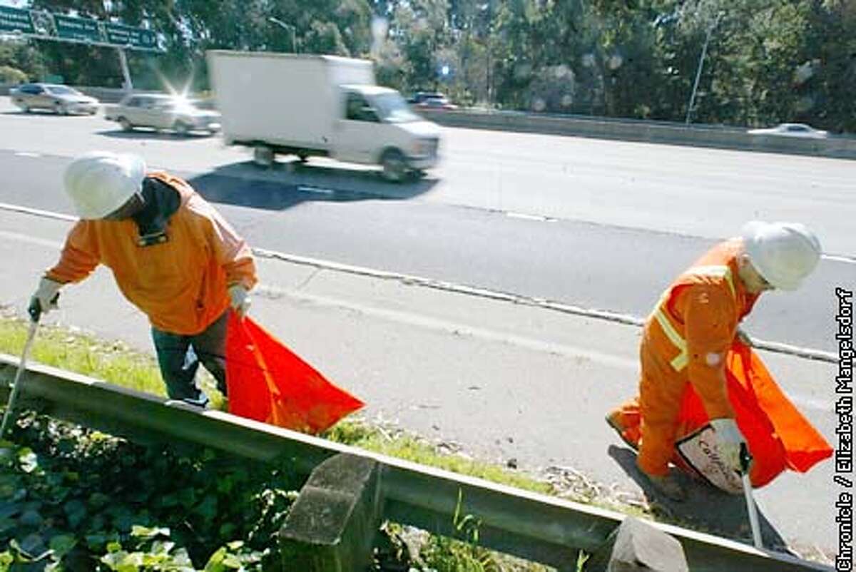 Sky-high highway litter / Caltrans workers make a mountain to make a point