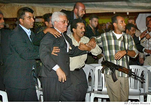 Gunfire erupts near new PLO leader / Abbas unhurt but 2 guards slain in ...