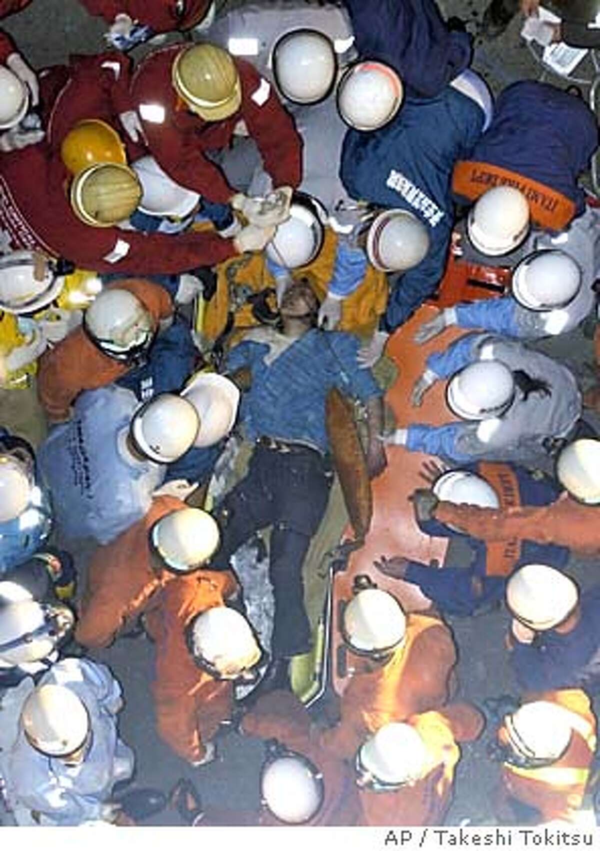 At least 73 dead in Japan rail crash / 7-car train slammed into building -- driver may have been ...