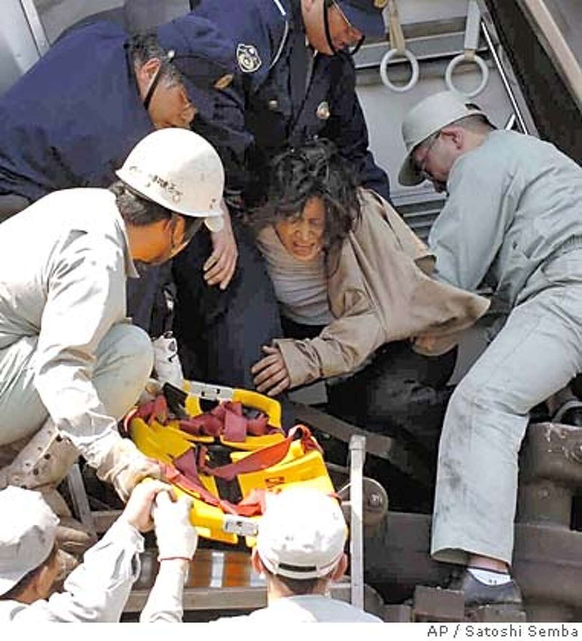 At least 73 dead in Japan rail crash / 7-car train slammed into building -- driver may have been ...