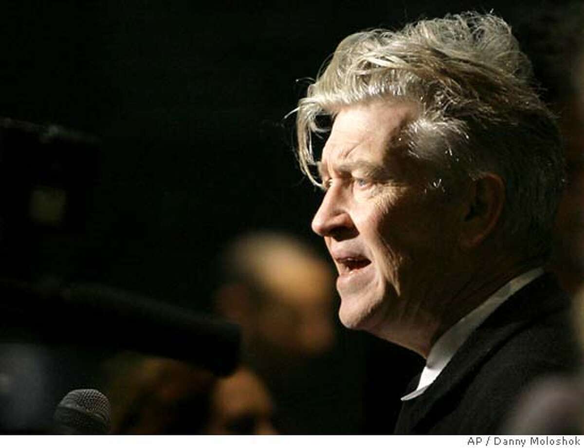 Lynch dives within / The cult director discusses bird feeders and pets ...