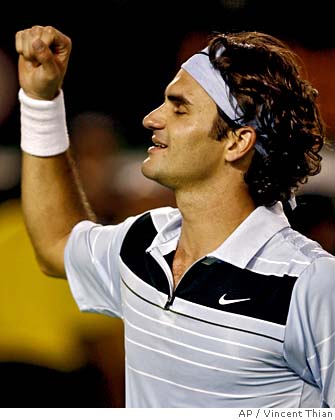 Federer wins, continues match against history