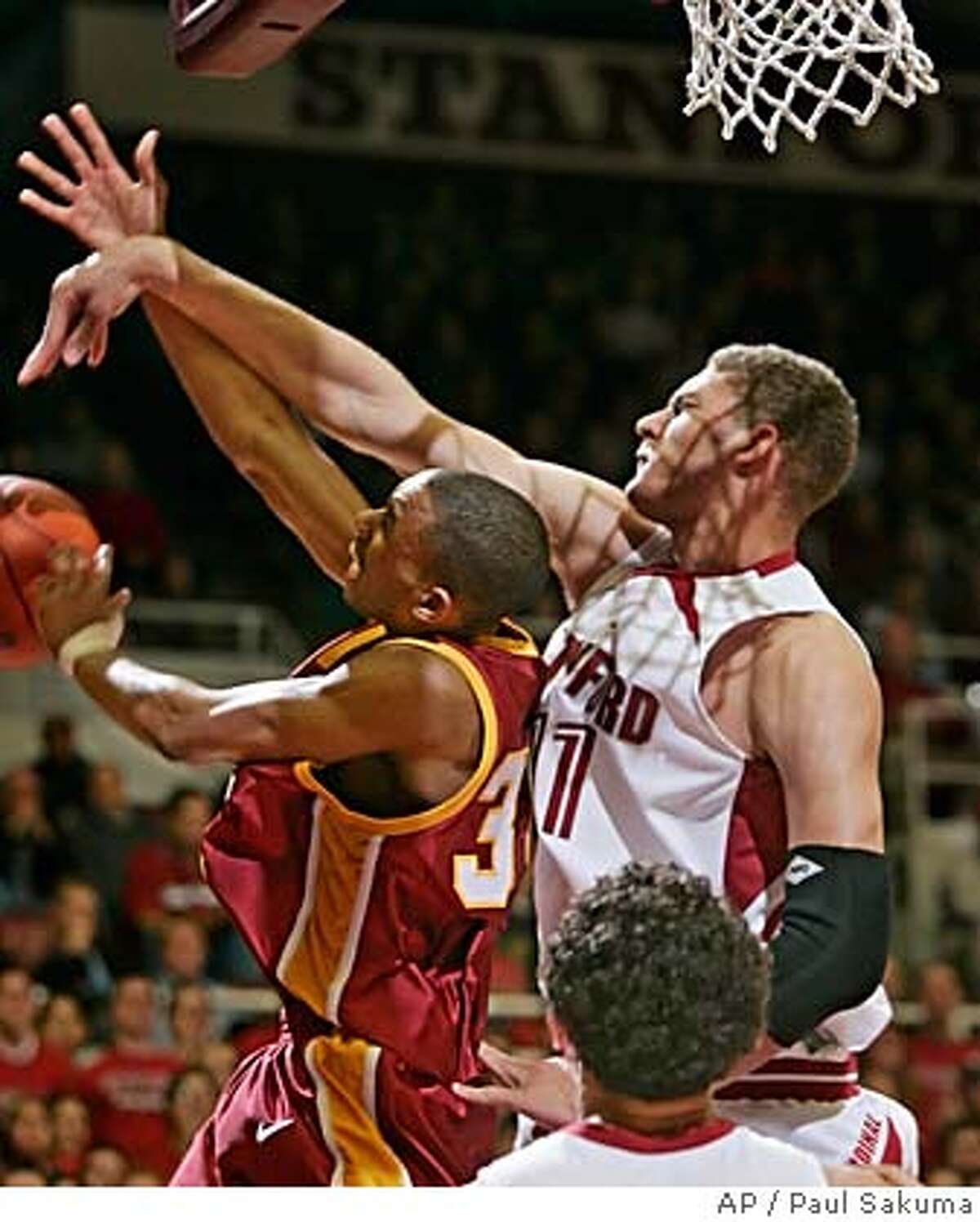 Stanford stuffs Trojans / Brook Lopez's 12 blocks set school record in win