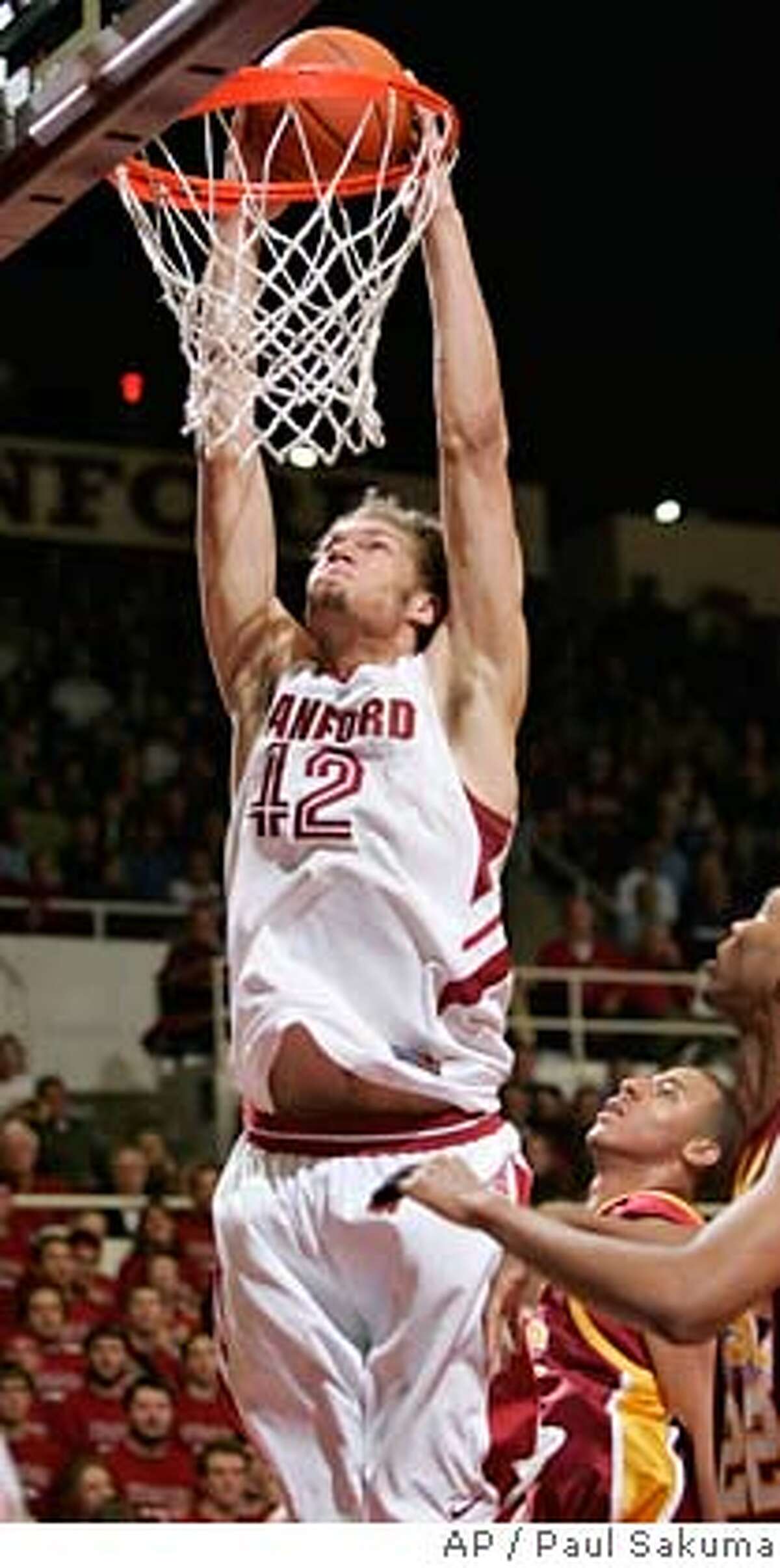 Stanford stuffs Trojans / Brook Lopez's 12 blocks set school record in win