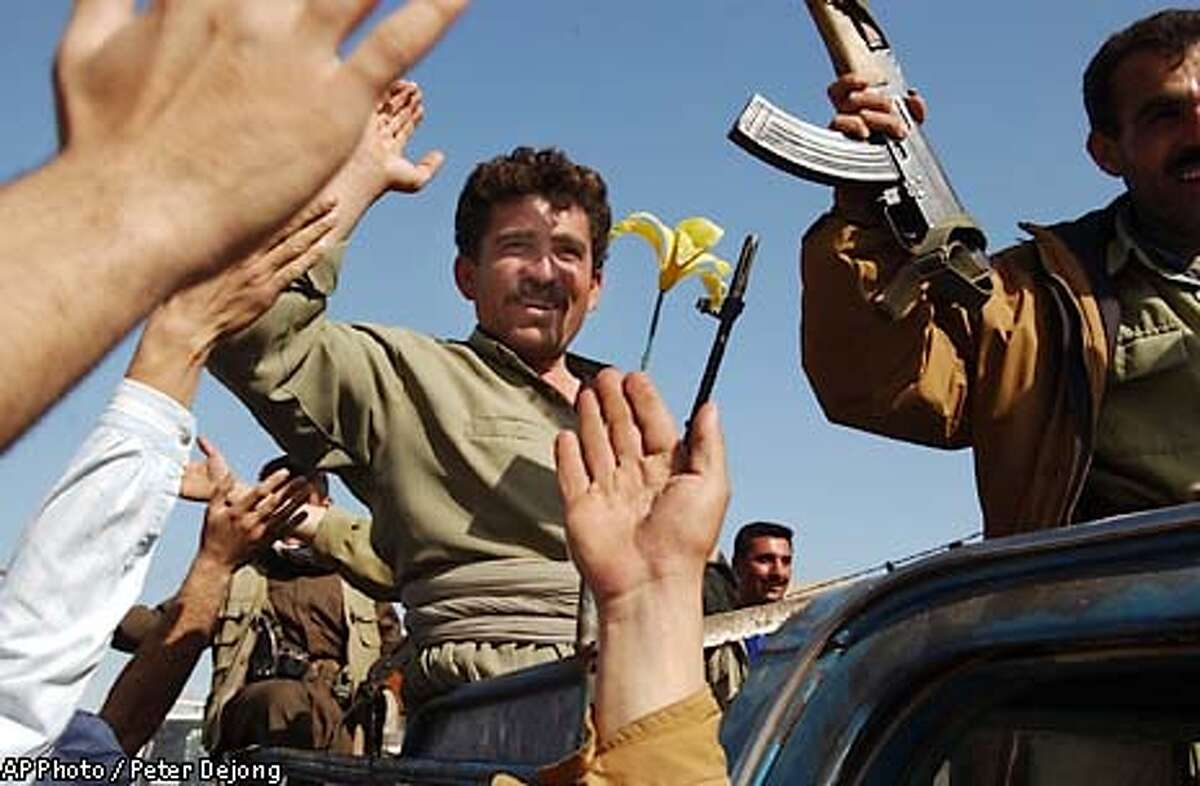 Kurds, U.S. seize oil wells / NORTHERN SURGE: Iraqi soldiers surrender ...