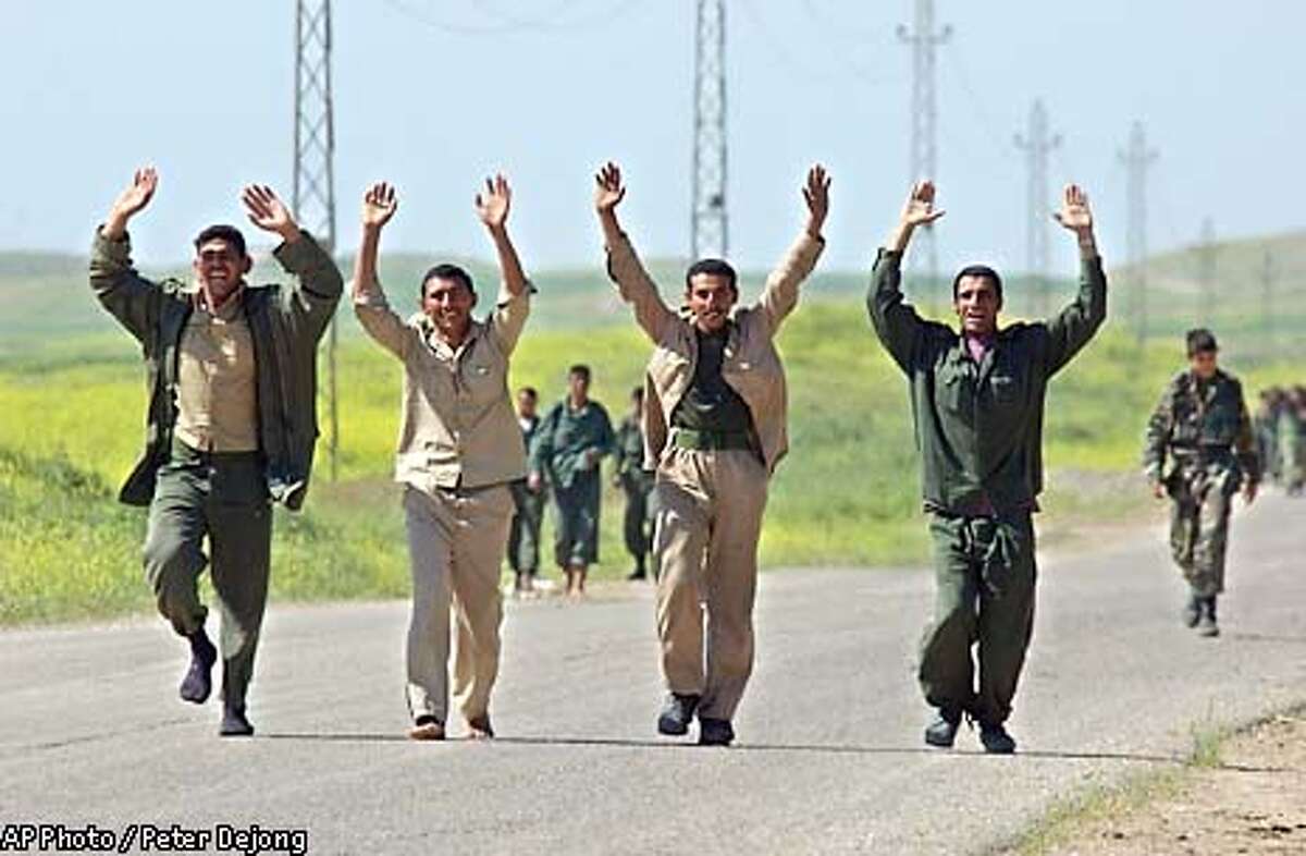 Kurds, U.S. seize oil wells / NORTHERN SURGE: Iraqi soldiers surrender ...