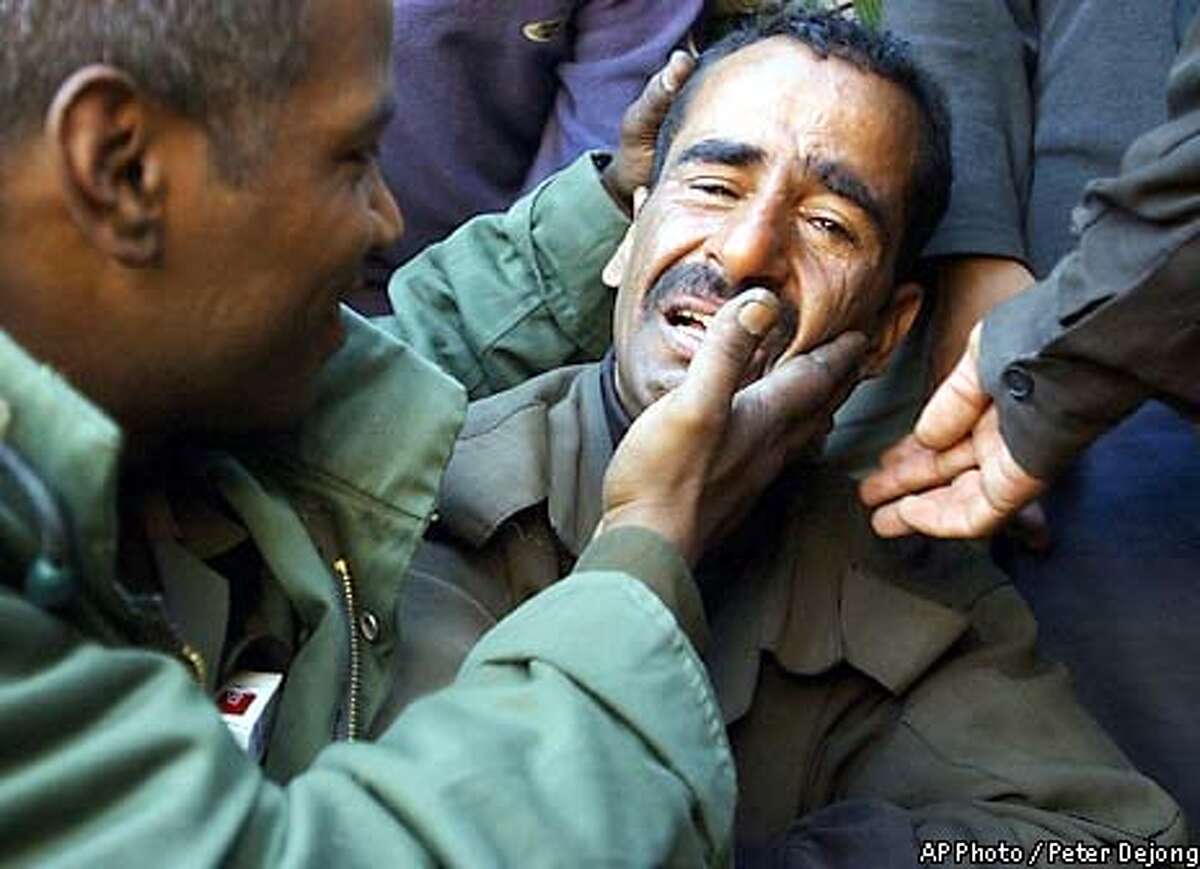 Kurds, U.S. seize oil wells / NORTHERN SURGE: Iraqi soldiers surrender ...