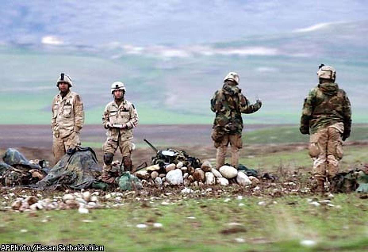 NORTHERN FRONT: paratroopers spend day digging out of the mud