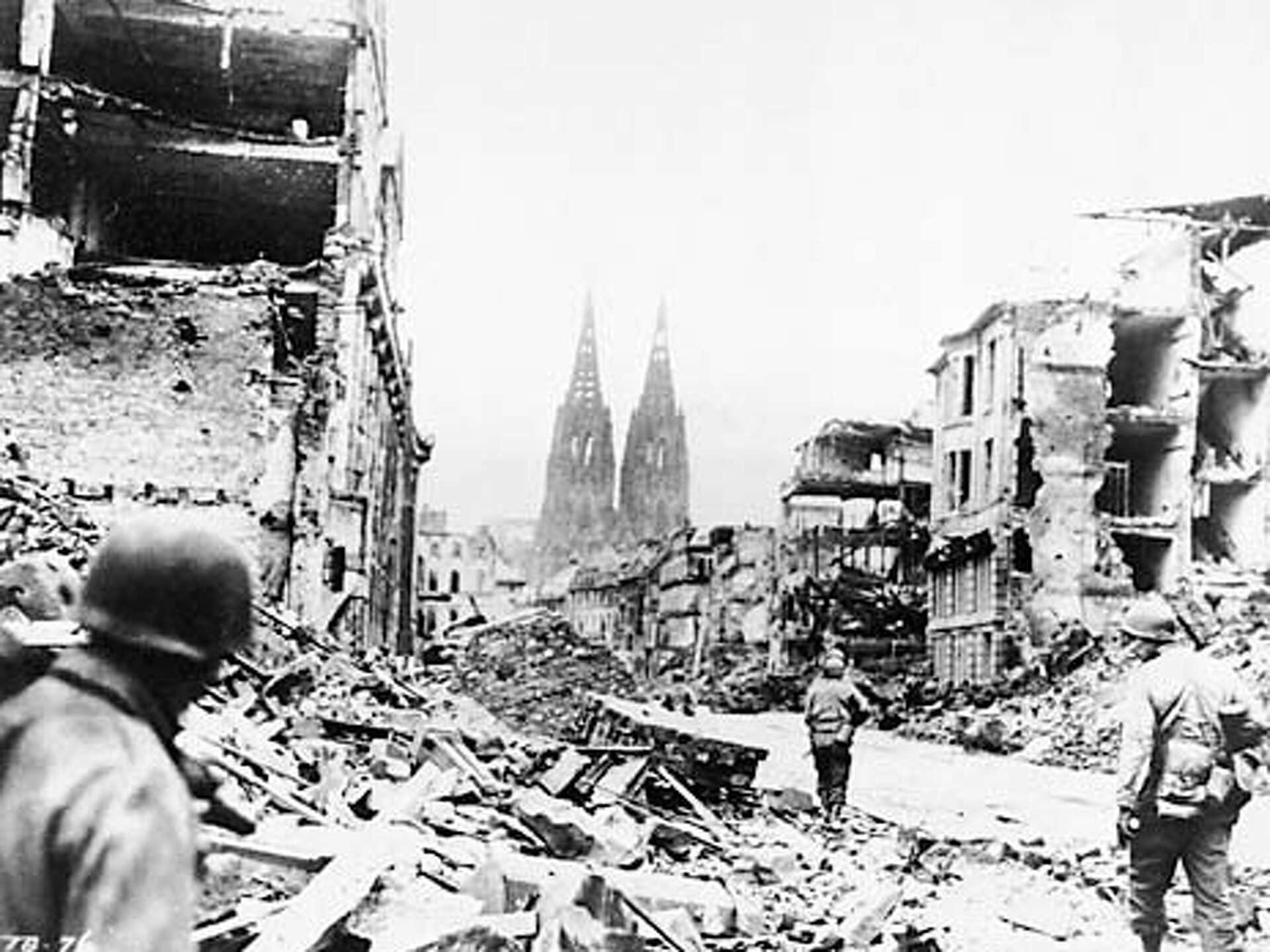 Experts question the parallel to rebuilding after WW II