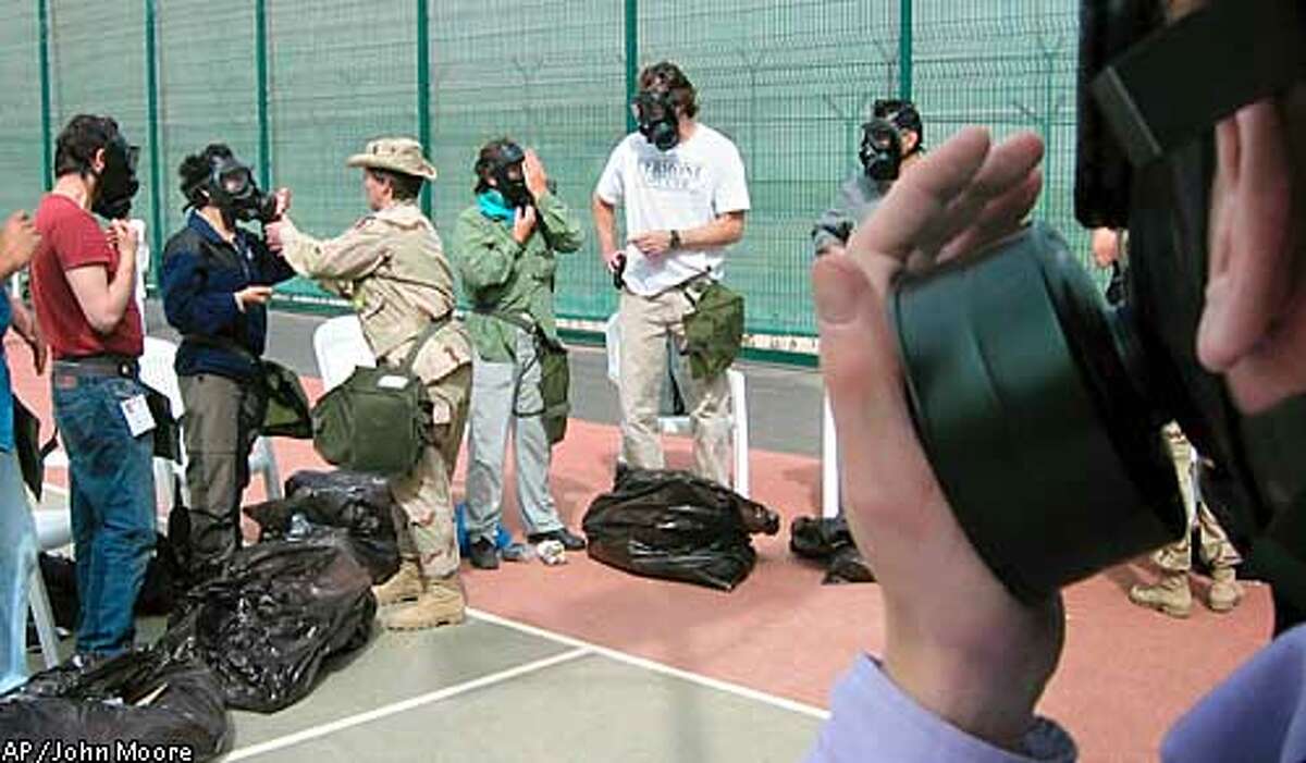 Media join troops preparing for war / 600 journalists 'embedded' with ...