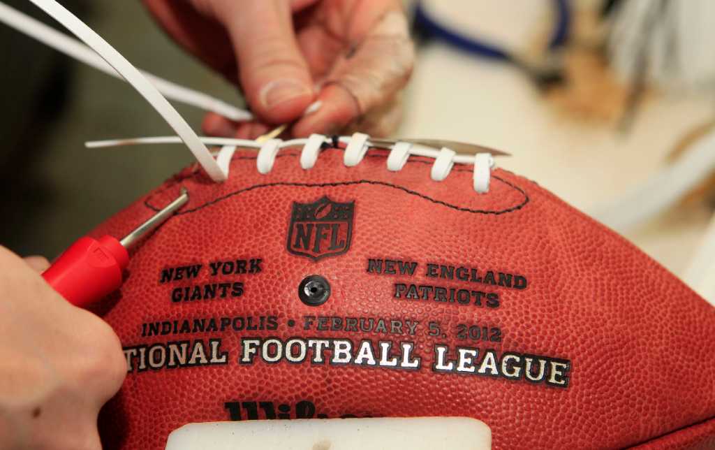 Making footballs for Super Bowl