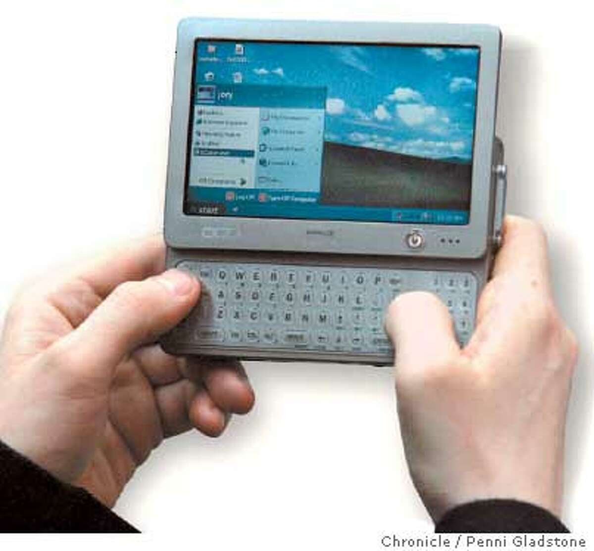 OQO puts the computing world in your palm / Tiny PC operates much like ...