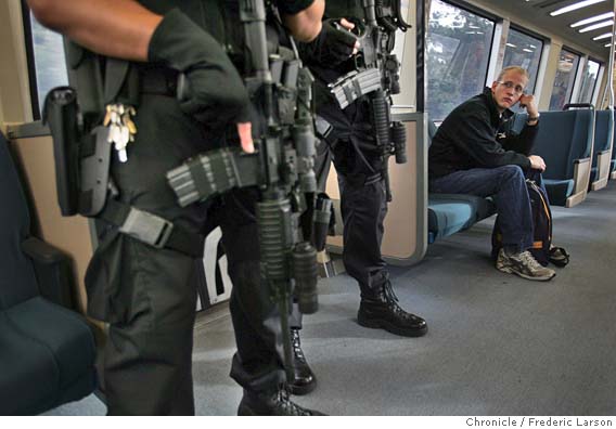 On guard on the tracks / Armed with automatic weapons, high-profile ...