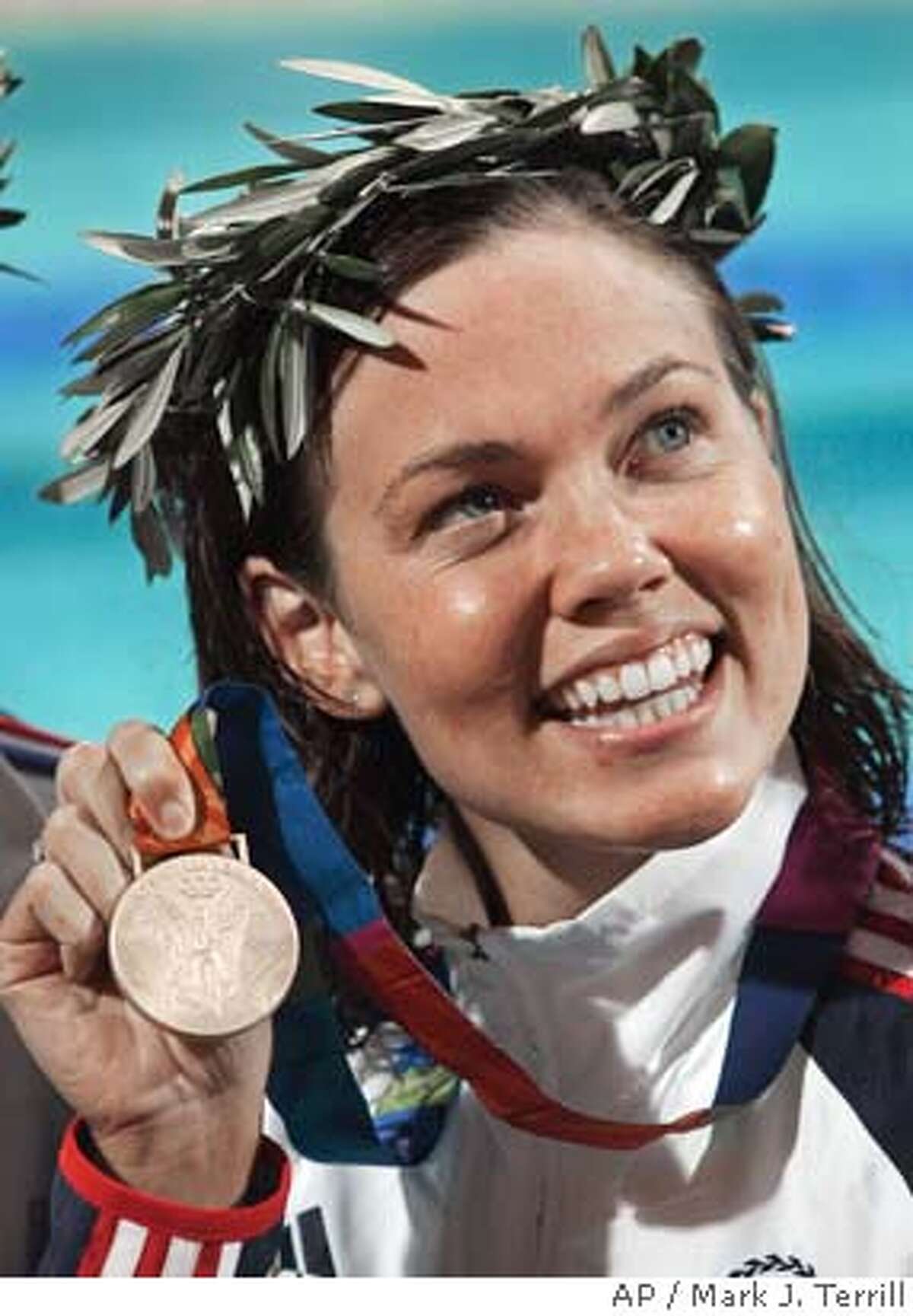 Golden moment for pride of Cal / Natalie Coughlin triumphs in 100-meter ...