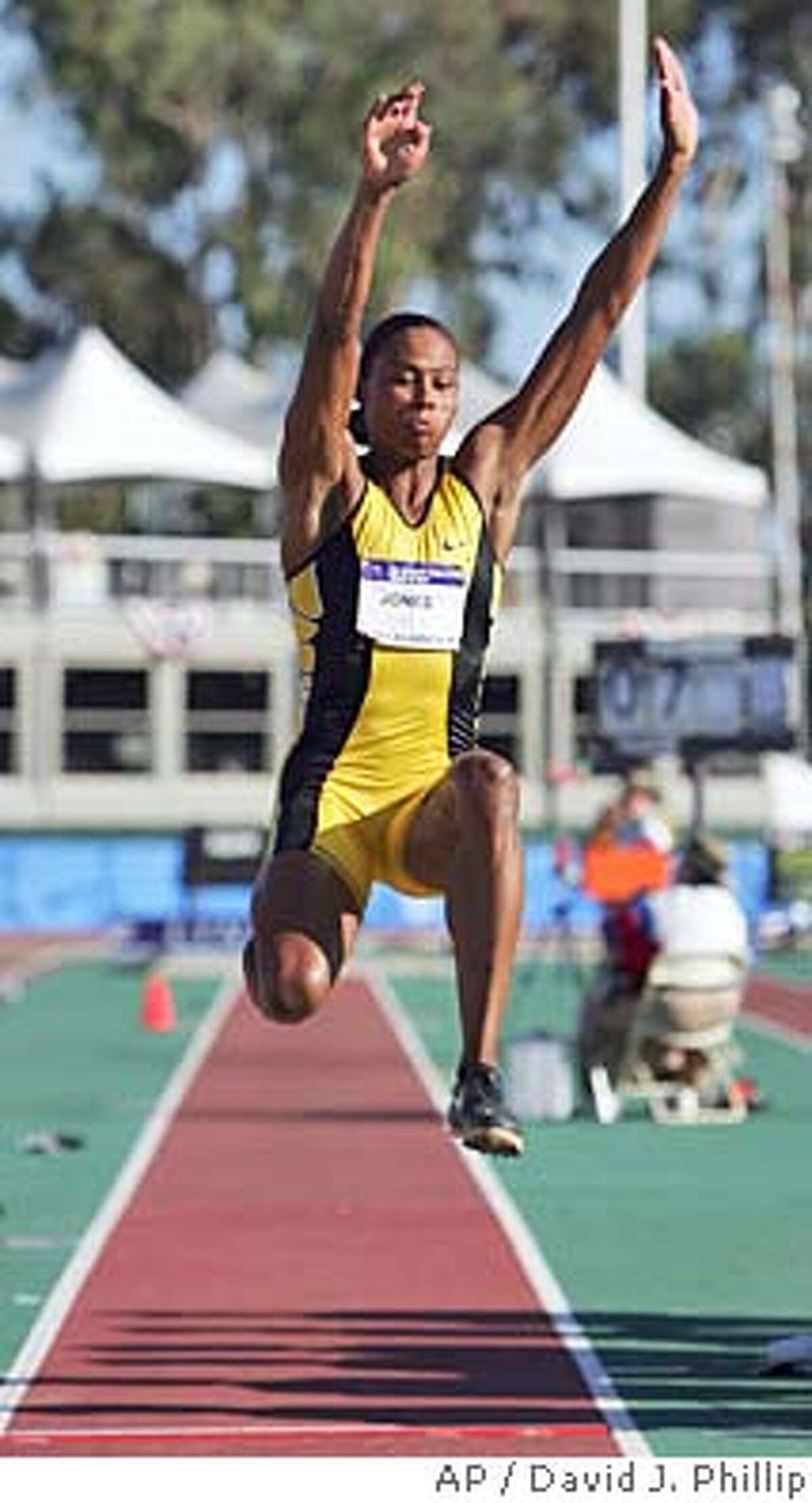 A joyous leap / Jones earns berth on U.S. team in long jump