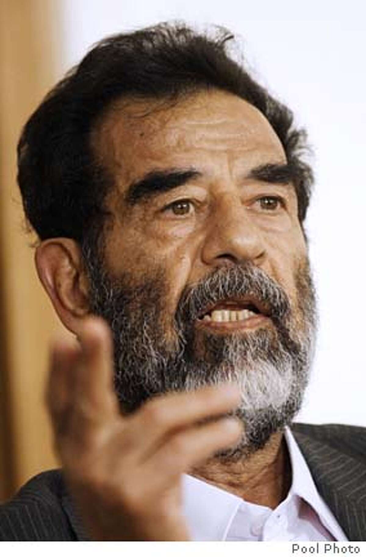 Seeing ex-dictator in court turns Iraqis into lawyers