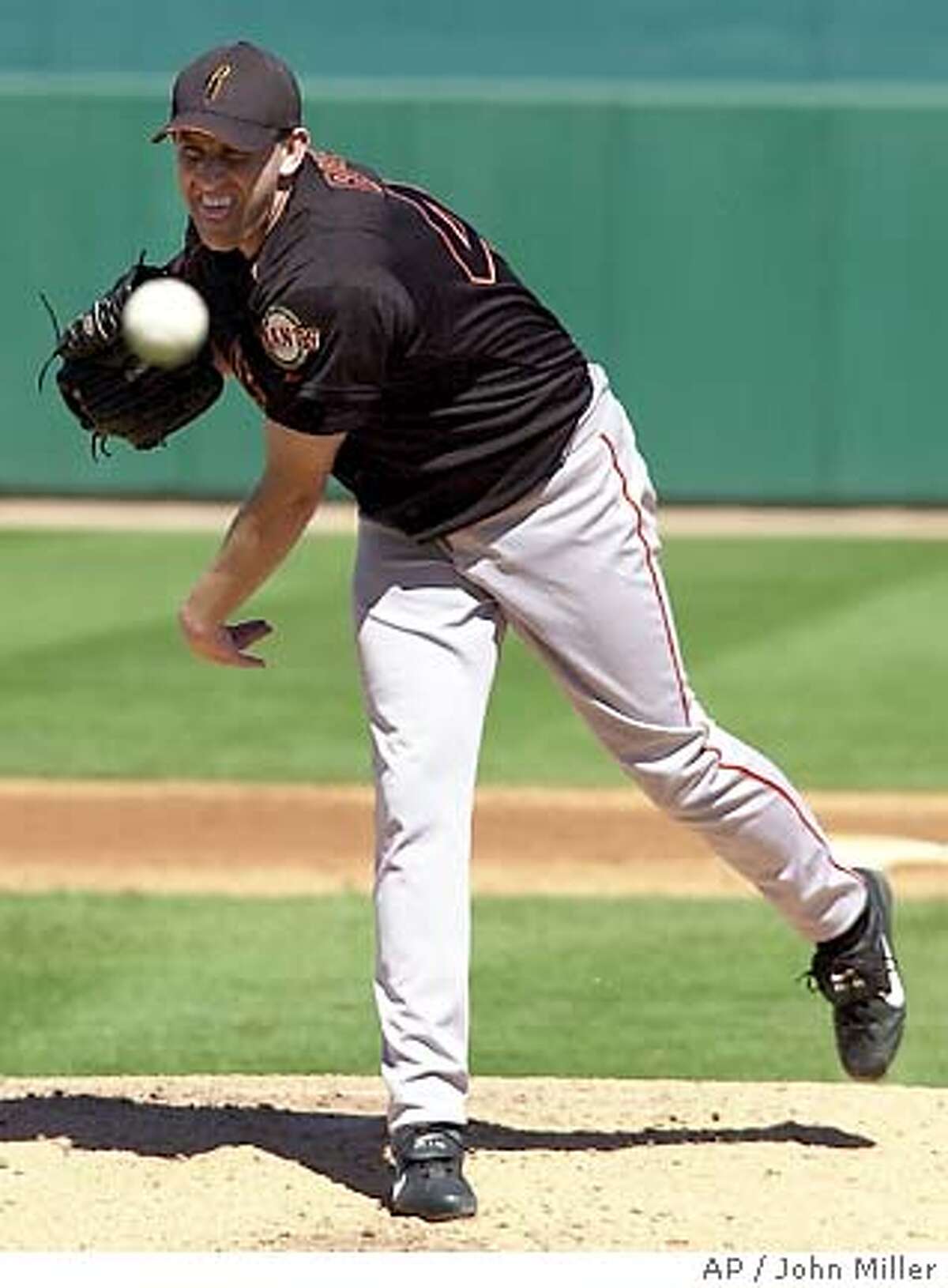 GIANTS NOTEBOOK / Rueter is pitching like an ace