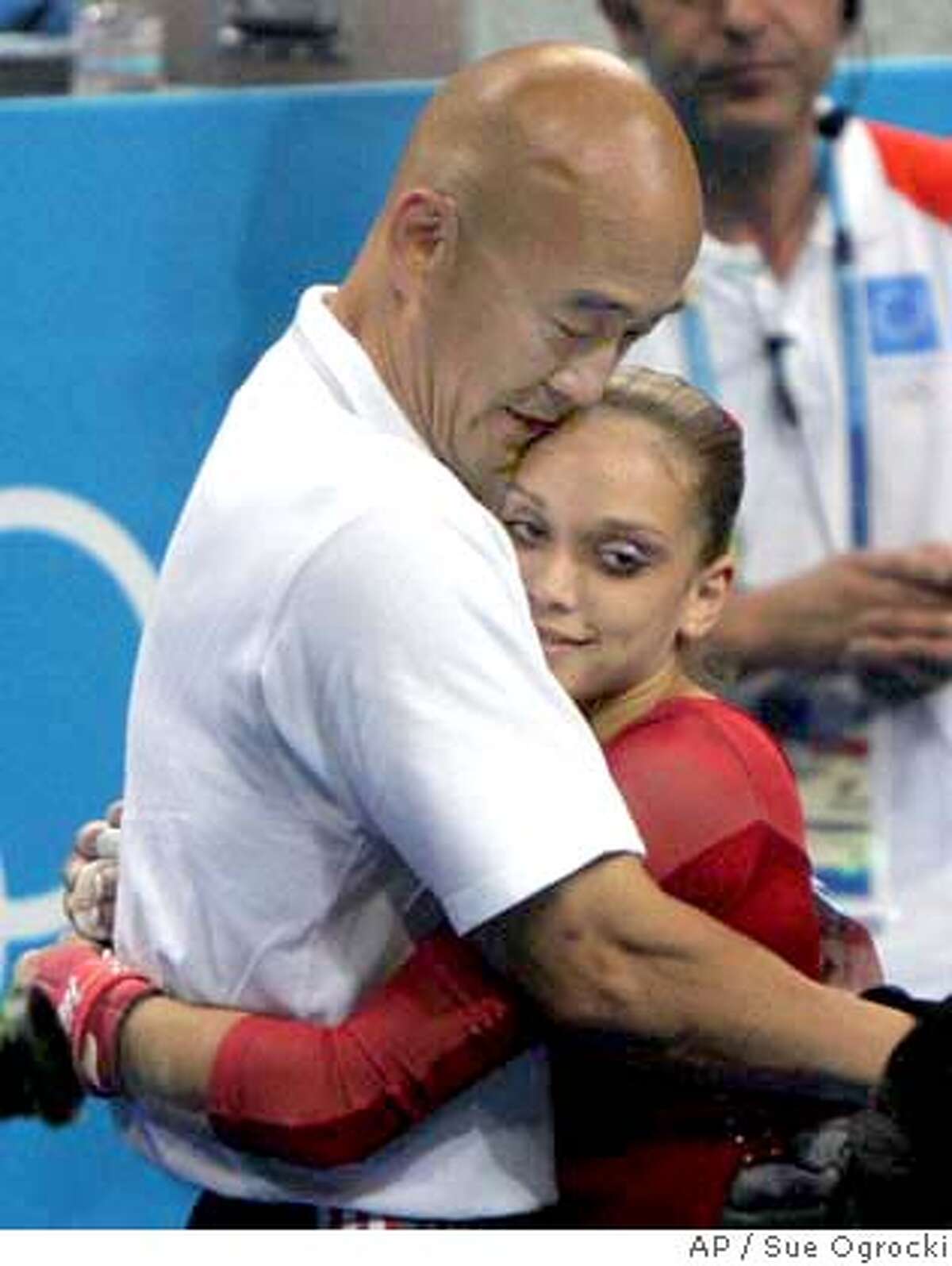 GYMNASTICS / Americans continue medal haul