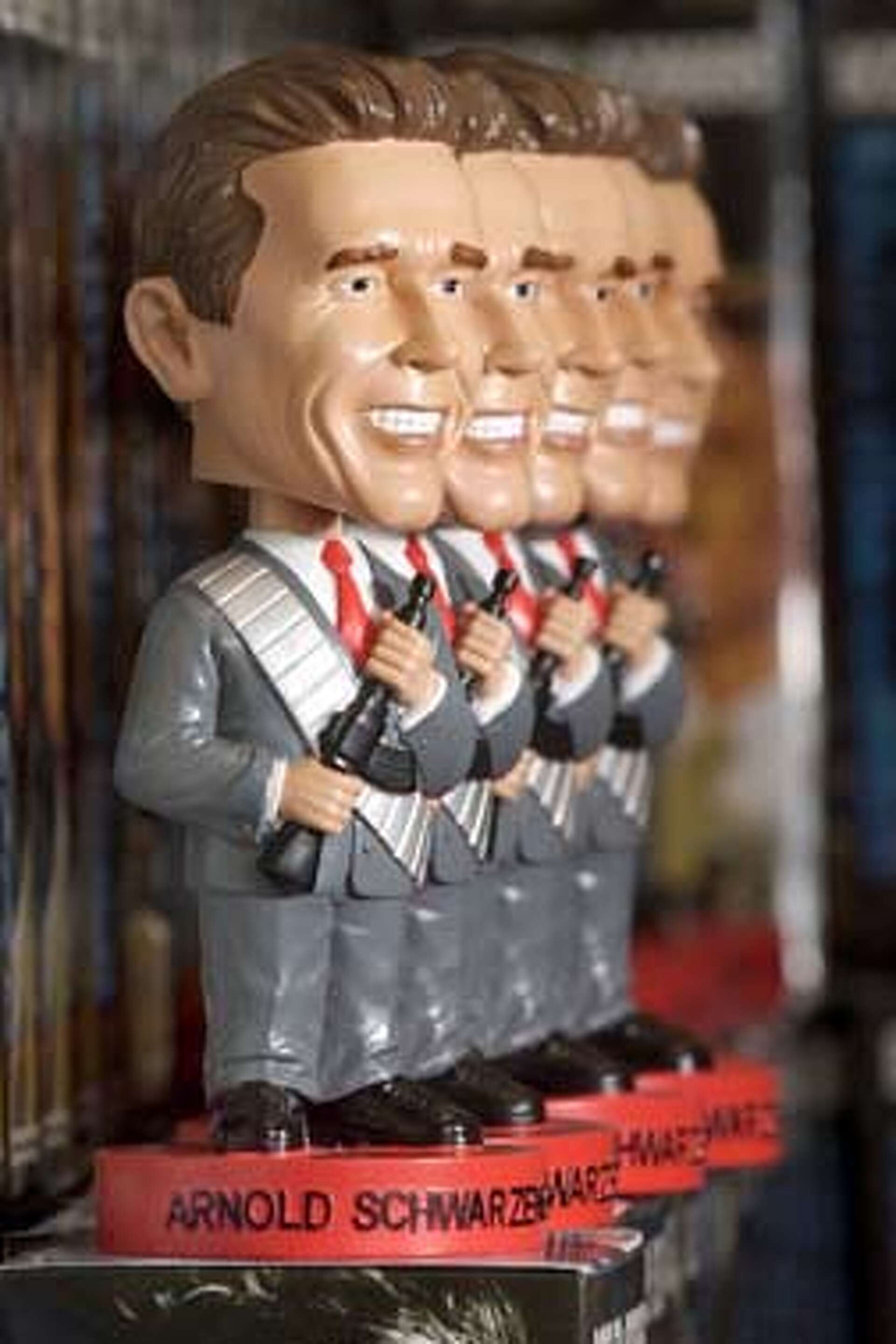 Governor's bobblehead says farewell to arms