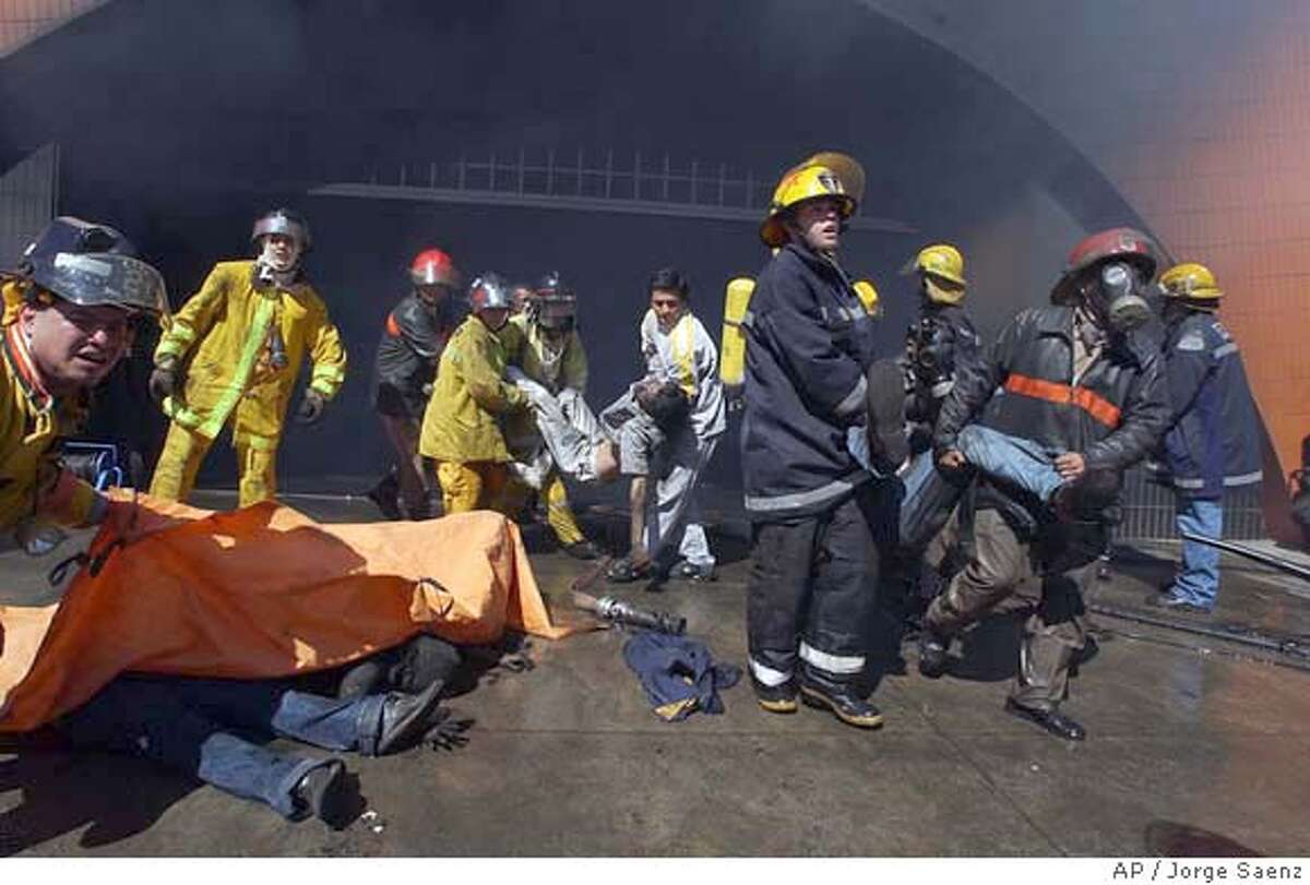 At least 256 die in Paraguay blast, fire / Shoppers reported trapped by ...