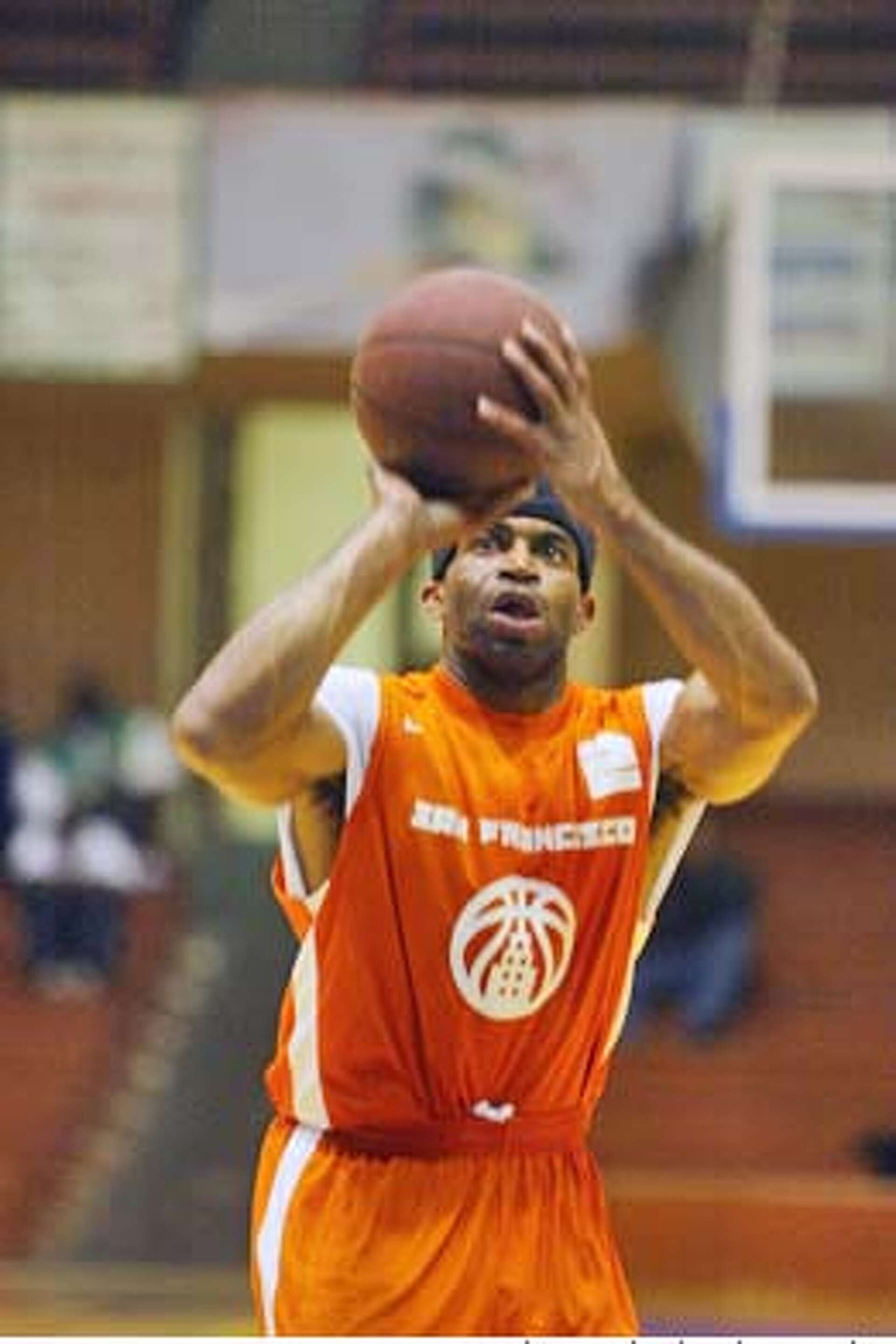 Rebound of a lifetime / Months after parole, playground basketball ...