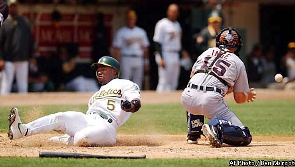 The timing is right as A's rock Tigers