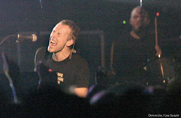 Coldplay opens up vast yet intimate world / Second-wave Brit-pop group ...